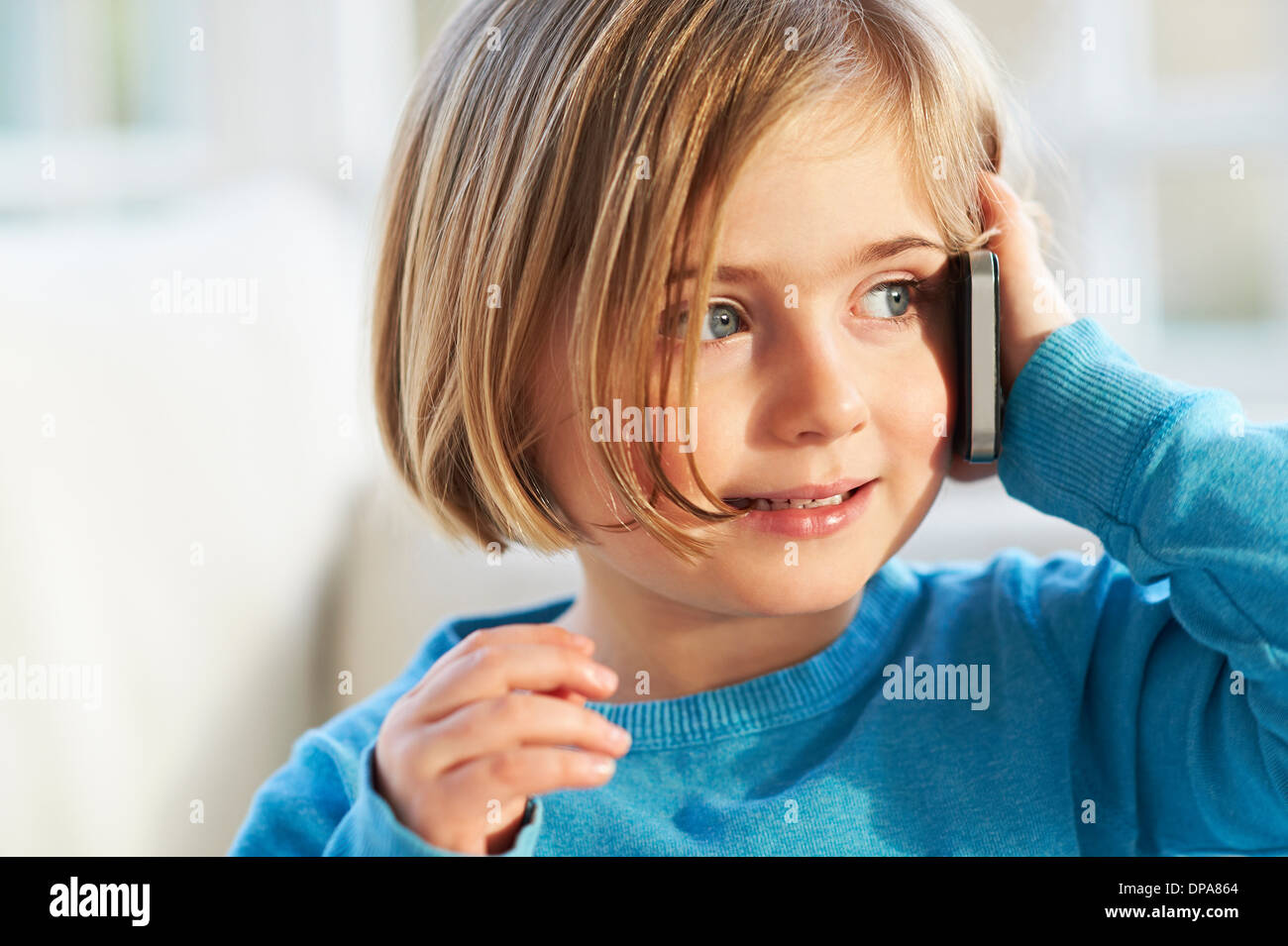 Girl making phonecall using smartphone Stock Photo - Alamy