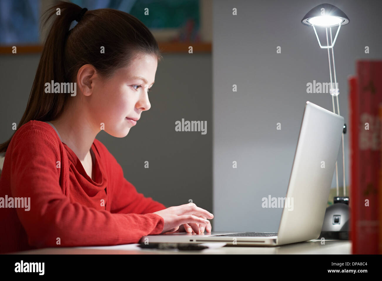 Girl using laptop computer Stock Photo - Alamy
