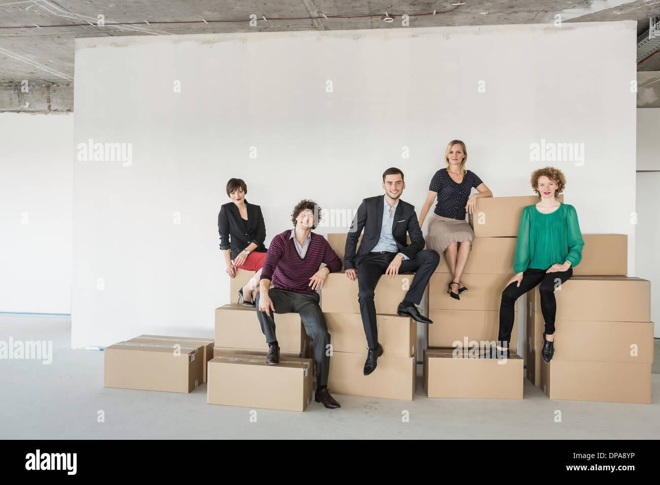 Sitting man sitting on boxes hi-res stock photography and images - Alamy