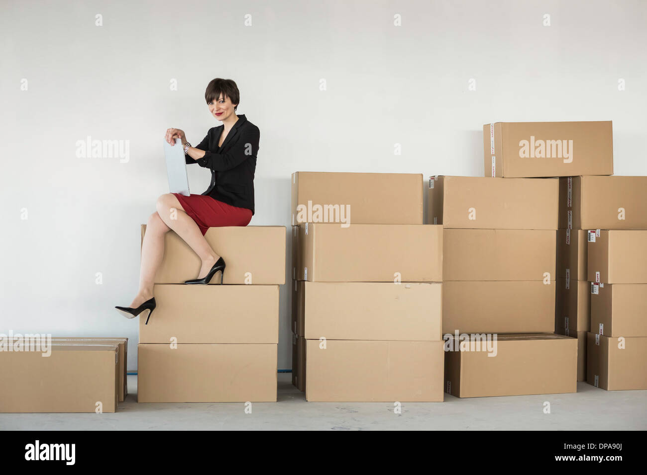 Sitting on boxes hi-res stock photography and images - Alamy