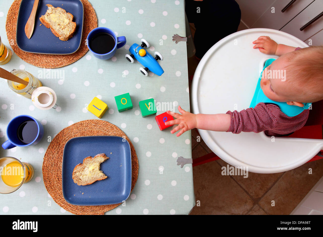 Baby spelling with alphabet blocks Stock Photo - Alamy
