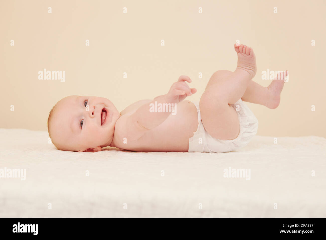 Portrait of baby kicking Stock Photo - Alamy