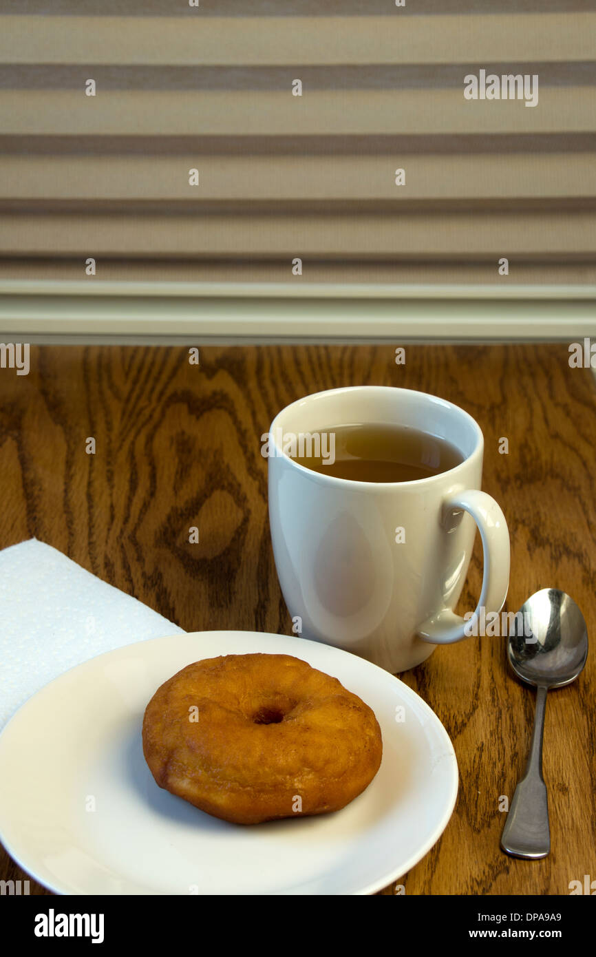Morning tea with a home made doughnut Stock Photo - Alamy