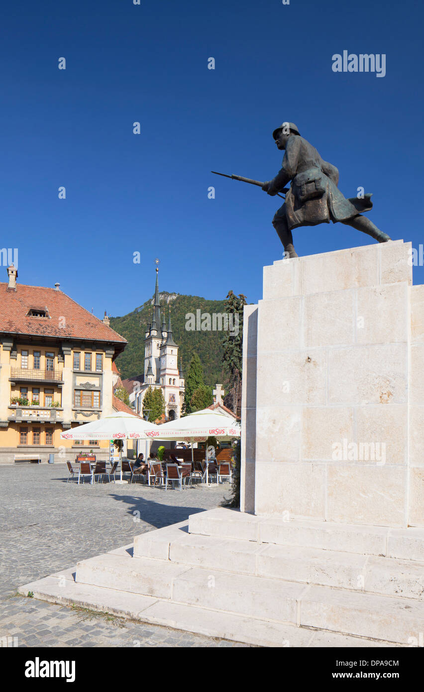 Statue in Piata Unirii with St Nicholas' Cathedral, Brasov ...