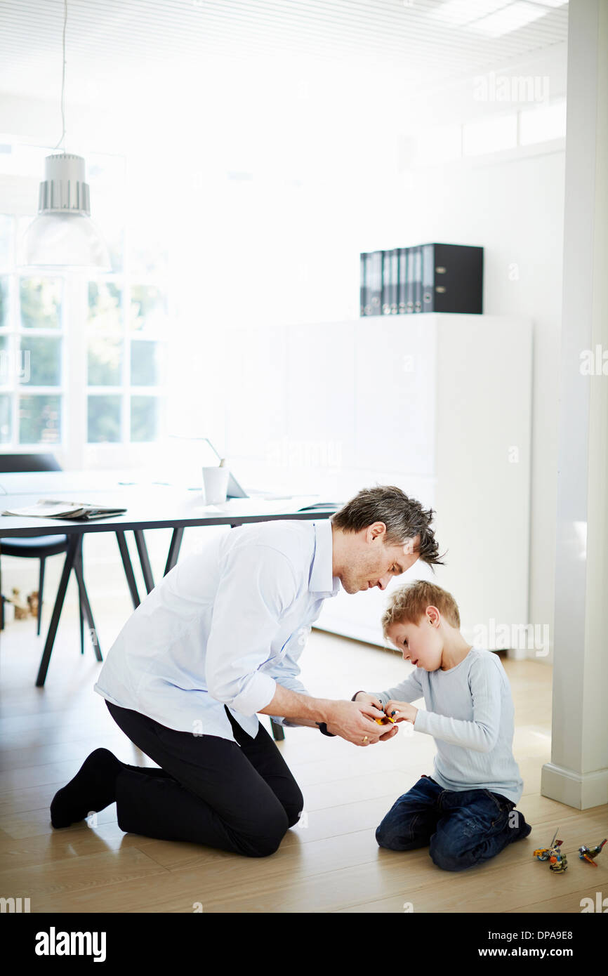 Father and son playing with toys Stock Photo - Alamy