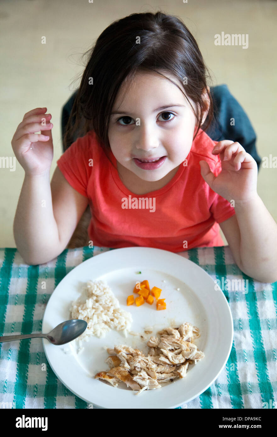 Girl child eating dinner hi-res stock photography and images - Alamy