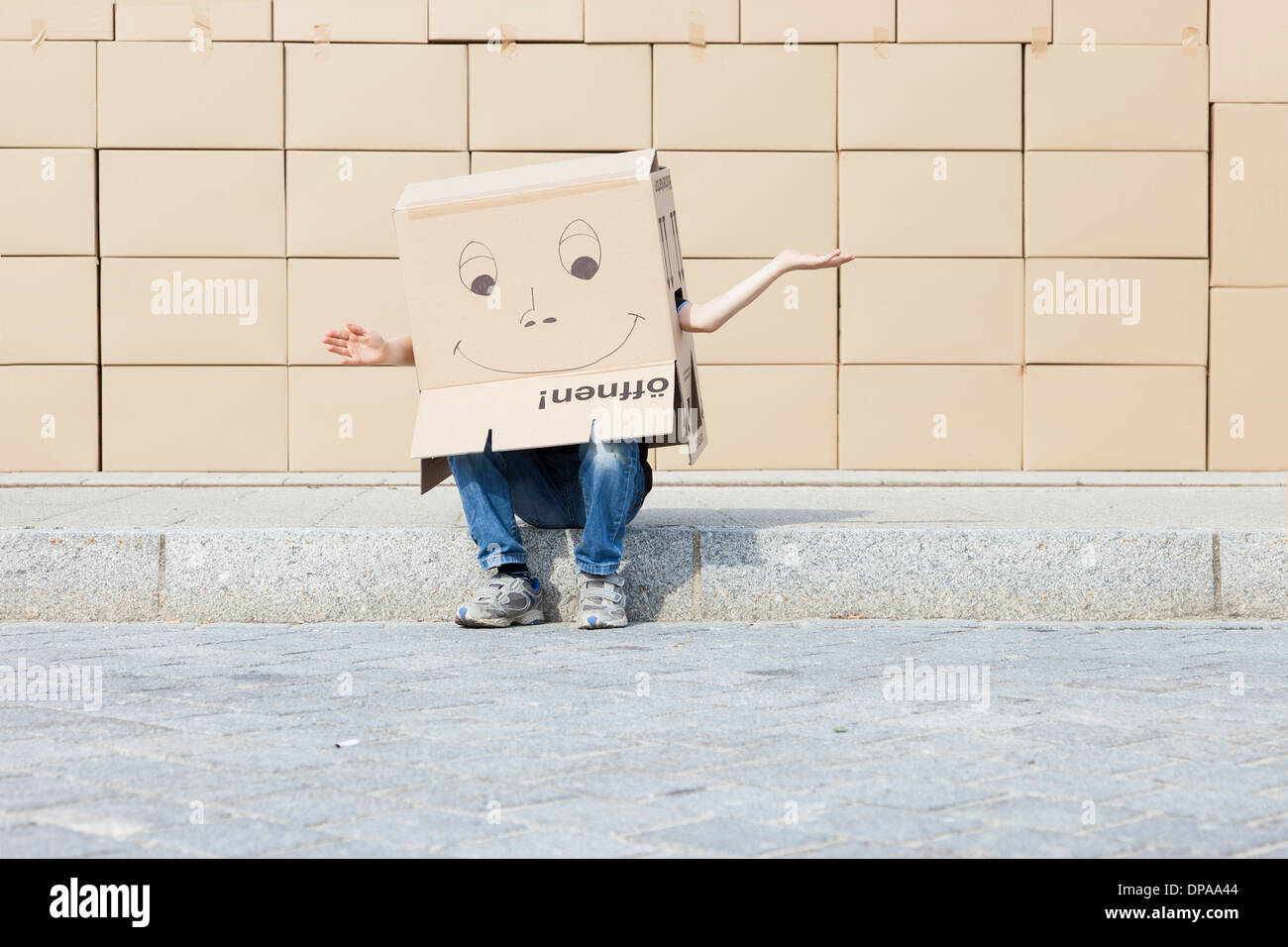 Man wearing cardboard box covering his head Stock Photo - Alamy