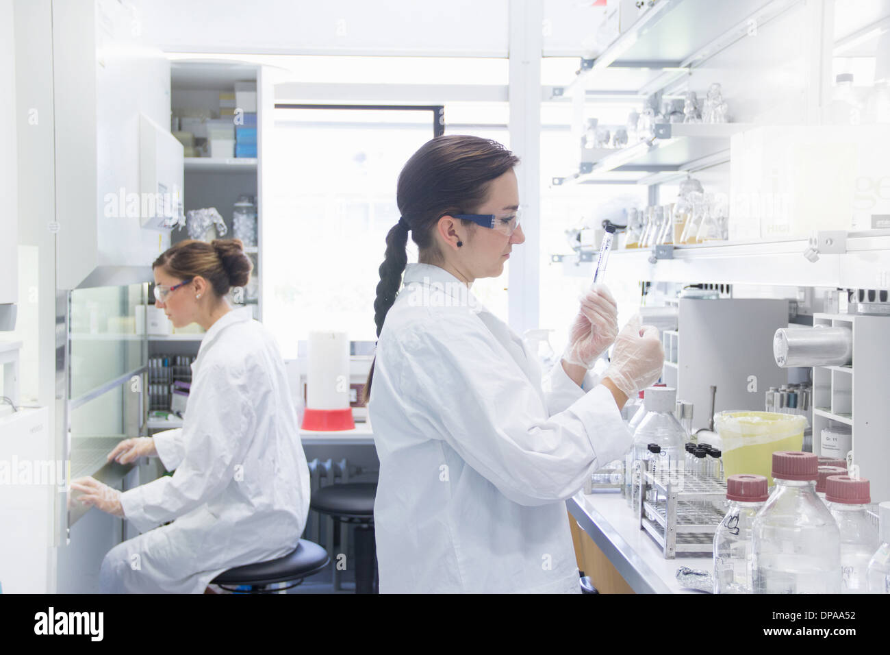 Biology students working in lab Stock Photo - Alamy