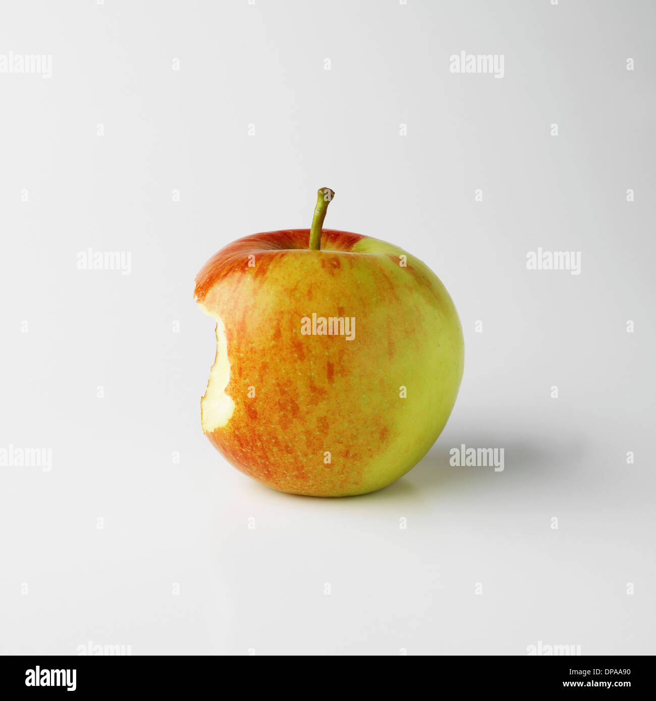 One apple on white background with bite mark Stock Photo - Alamy