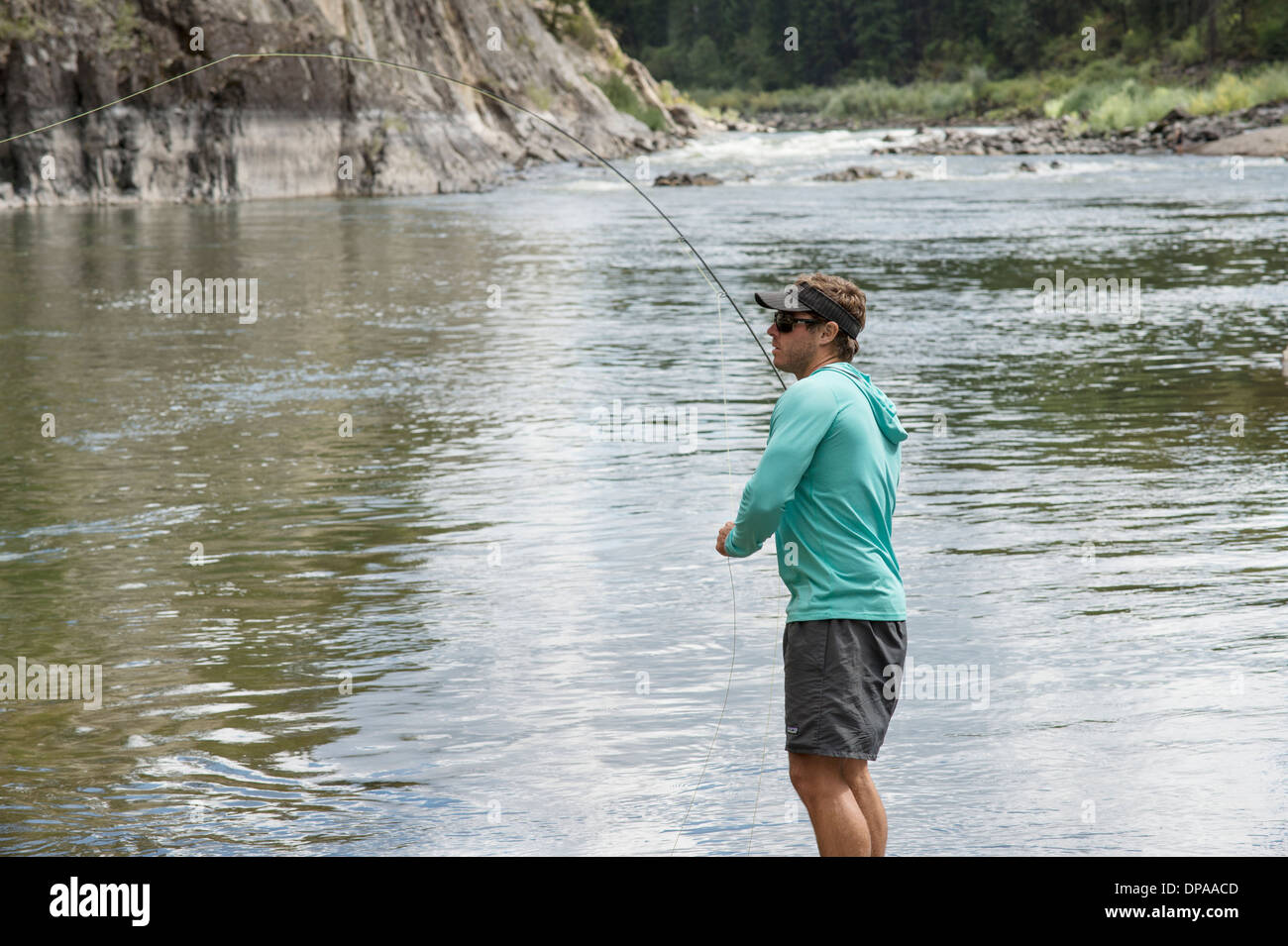 Man fly fishing in the Clark Fork River in Montana Stock Photo - Alamy
