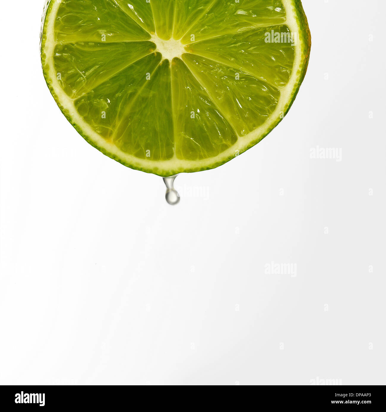 Juice dripping from lime Stock Photo - Alamy