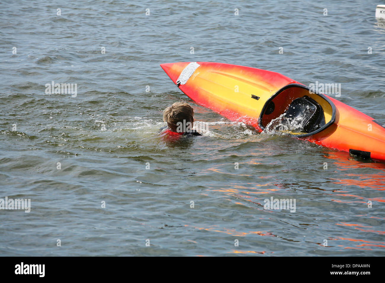 Fallen from his kayak Stock Photo - Alamy