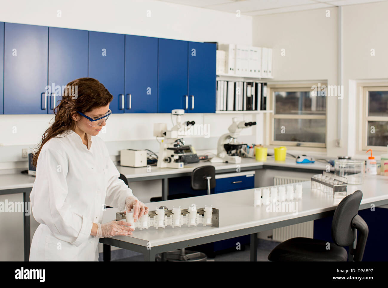 Female scientist working in laboratory Stock Photo - Alamy
