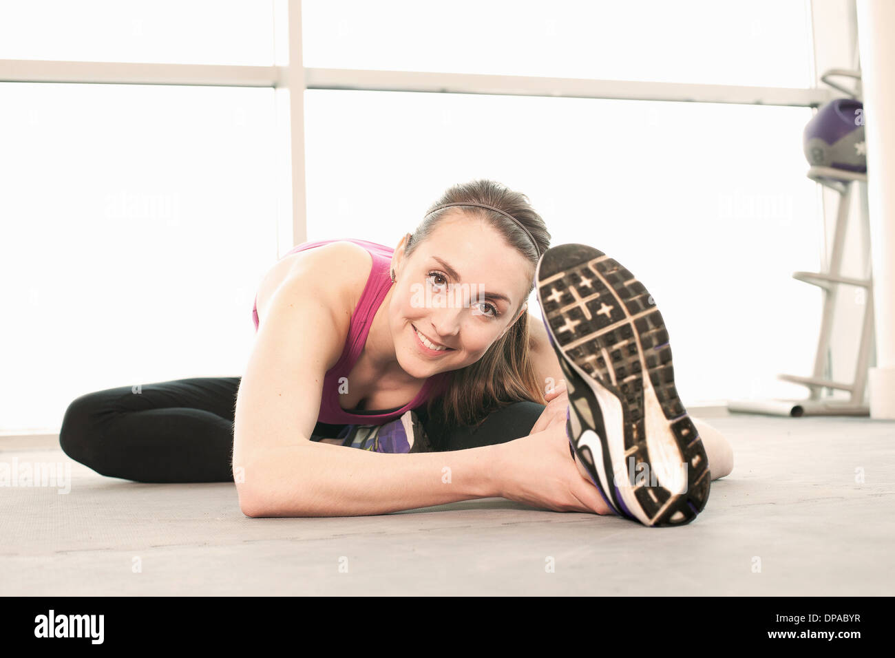 Woman stretching up smiling hi-res stock photography and images - Alamy