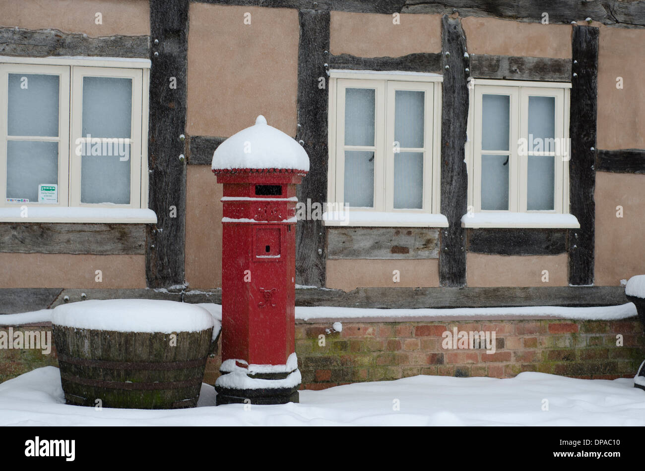 A red British post box coverd with snow Stock Photo - Alamy