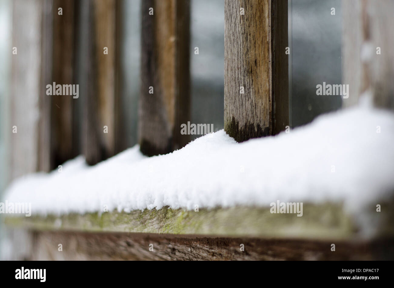 Snow settled on the bottom of a wooden window frame Stock Photo - Alamy