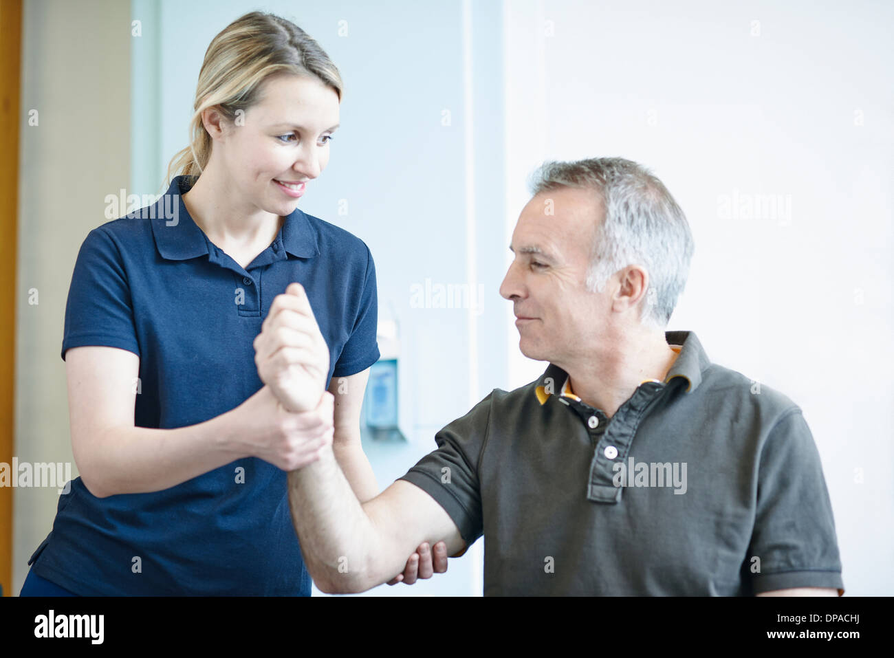 Helping arm hi-res stock photography and images - Alamy