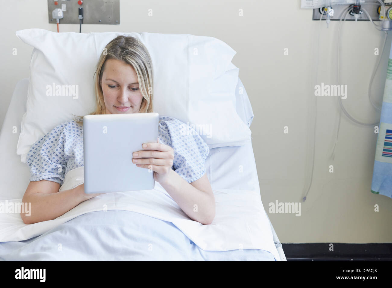 Female patient lying on bed hi-res stock photography and images - Alamy