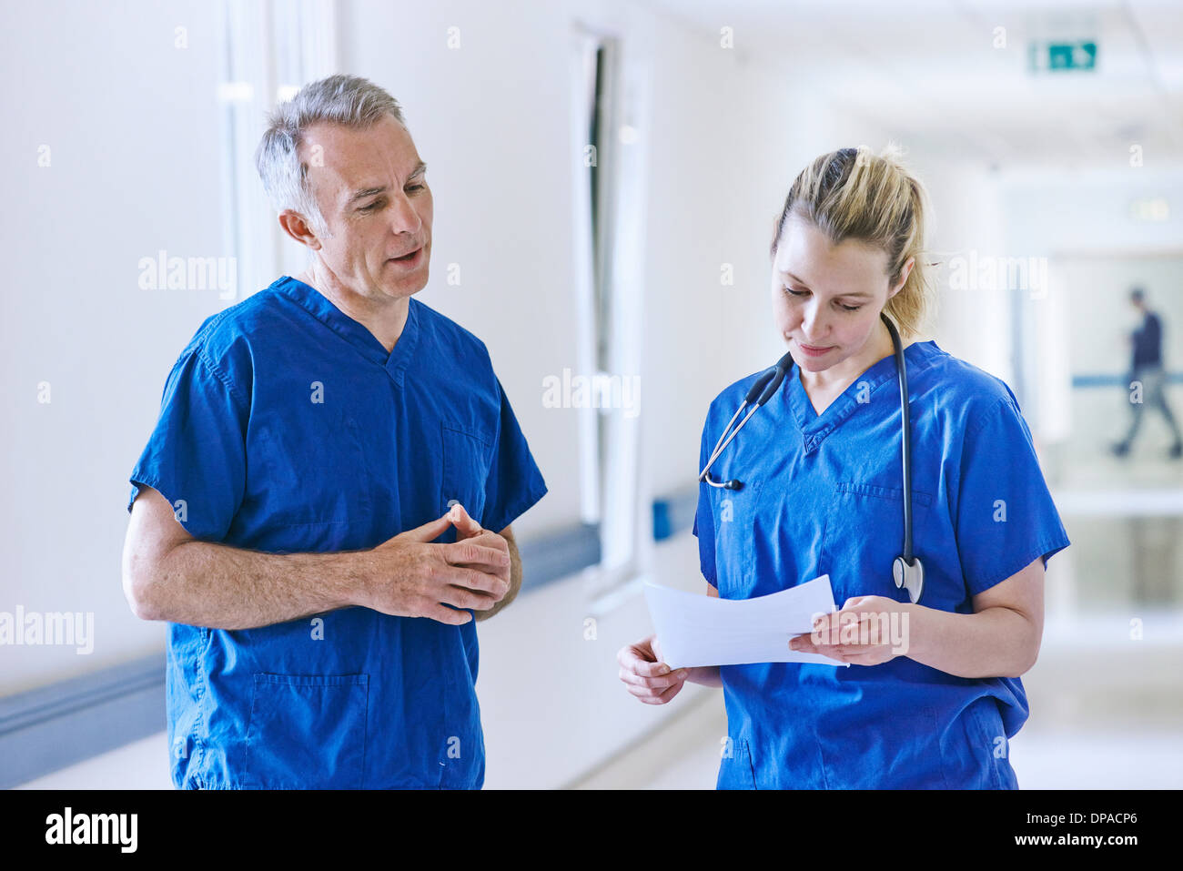 Doctors looking at medical records Stock Photo - Alamy