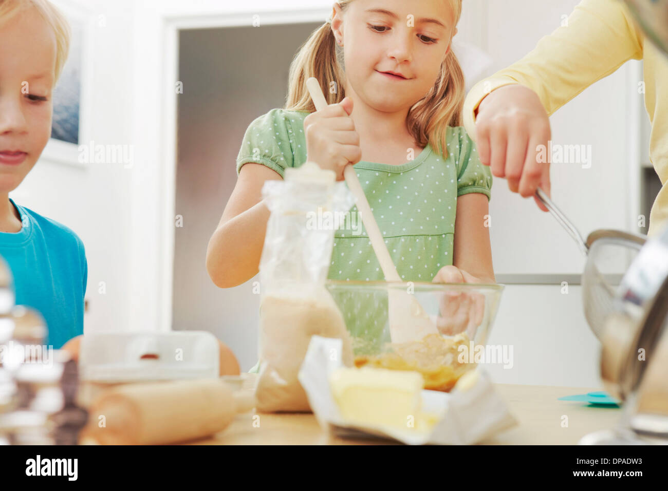 Boy and girl mixing ingredients hi-res stock photography and images - Alamy