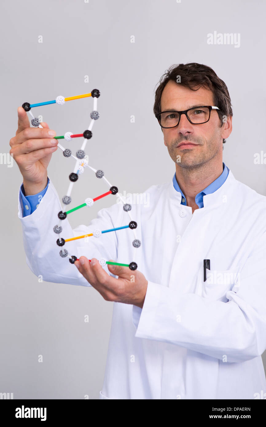 Portrait of scientist with dna molecular model Stock Photo - Alamy Portrait of scientist with dna molecular model Stock Photo - Alamy