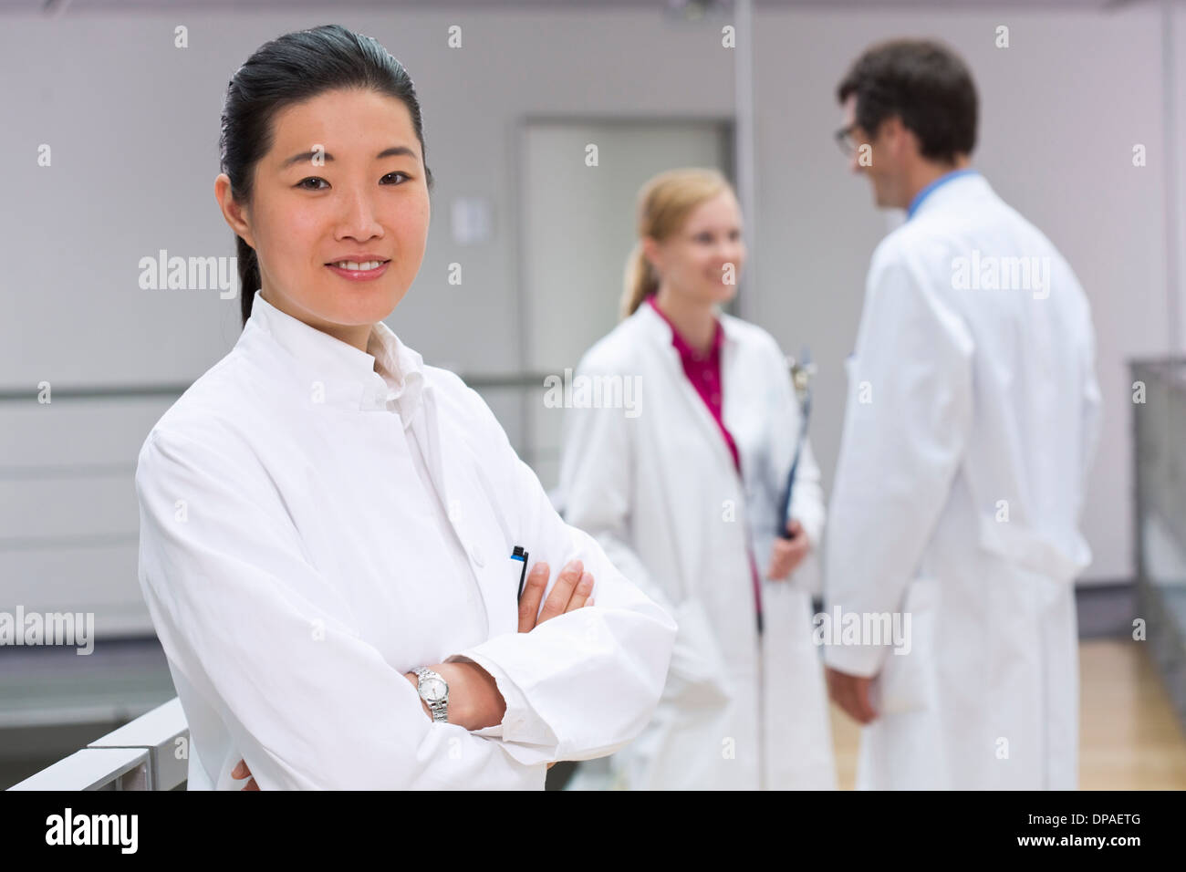 Small group of scientists in laboratory atrium Stock Photo - Alamy