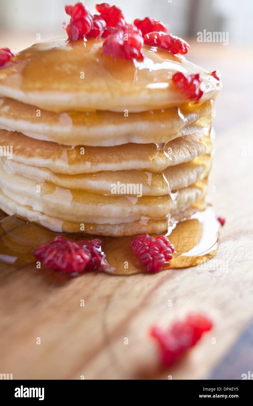 Pancakes with raspberries and syrup Stock Photo - Alamy