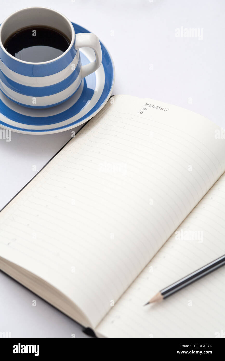 Coffee and open diary Stock Photo - Alamy