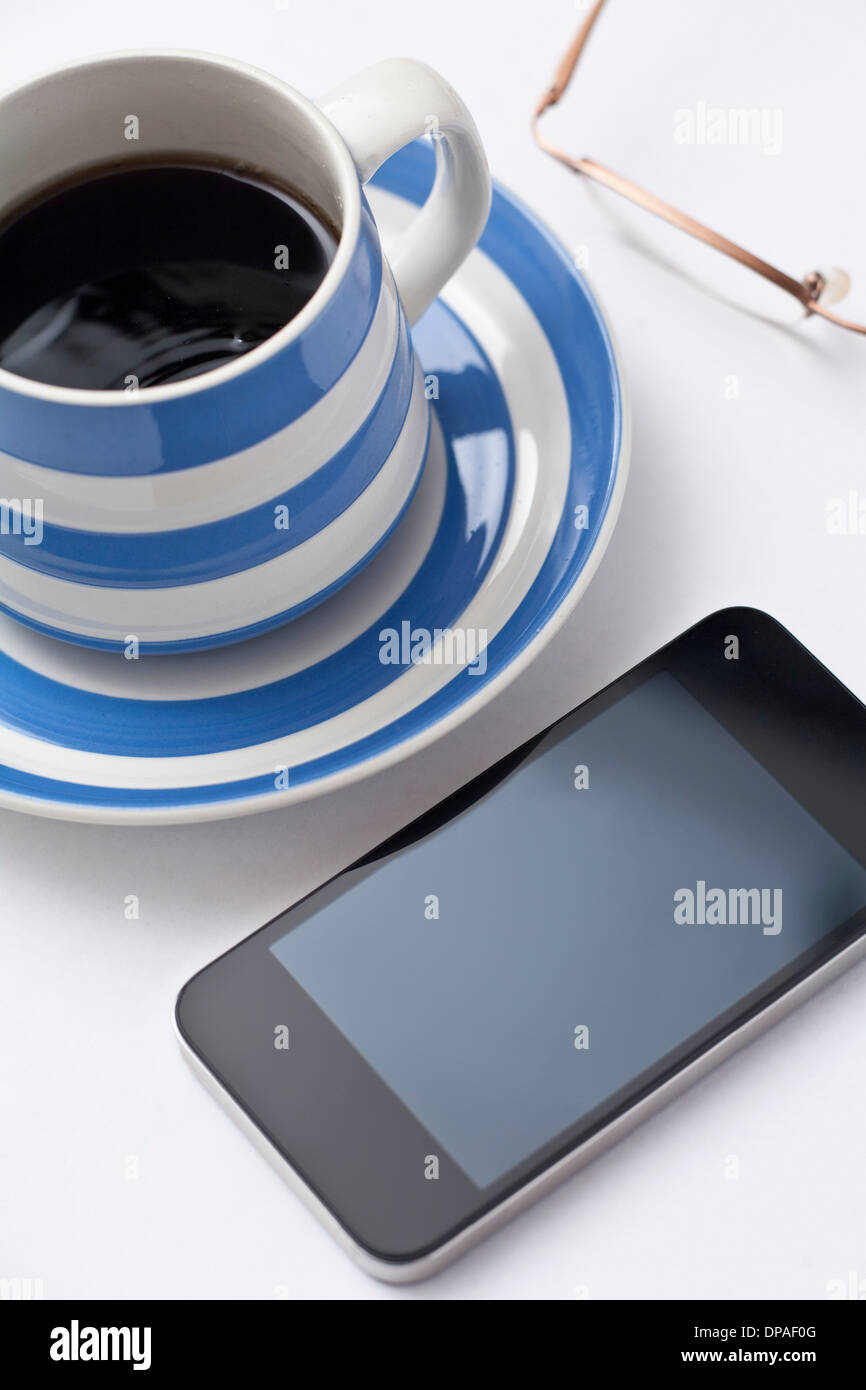 Smartphone and coffee Stock Photo - Alamy