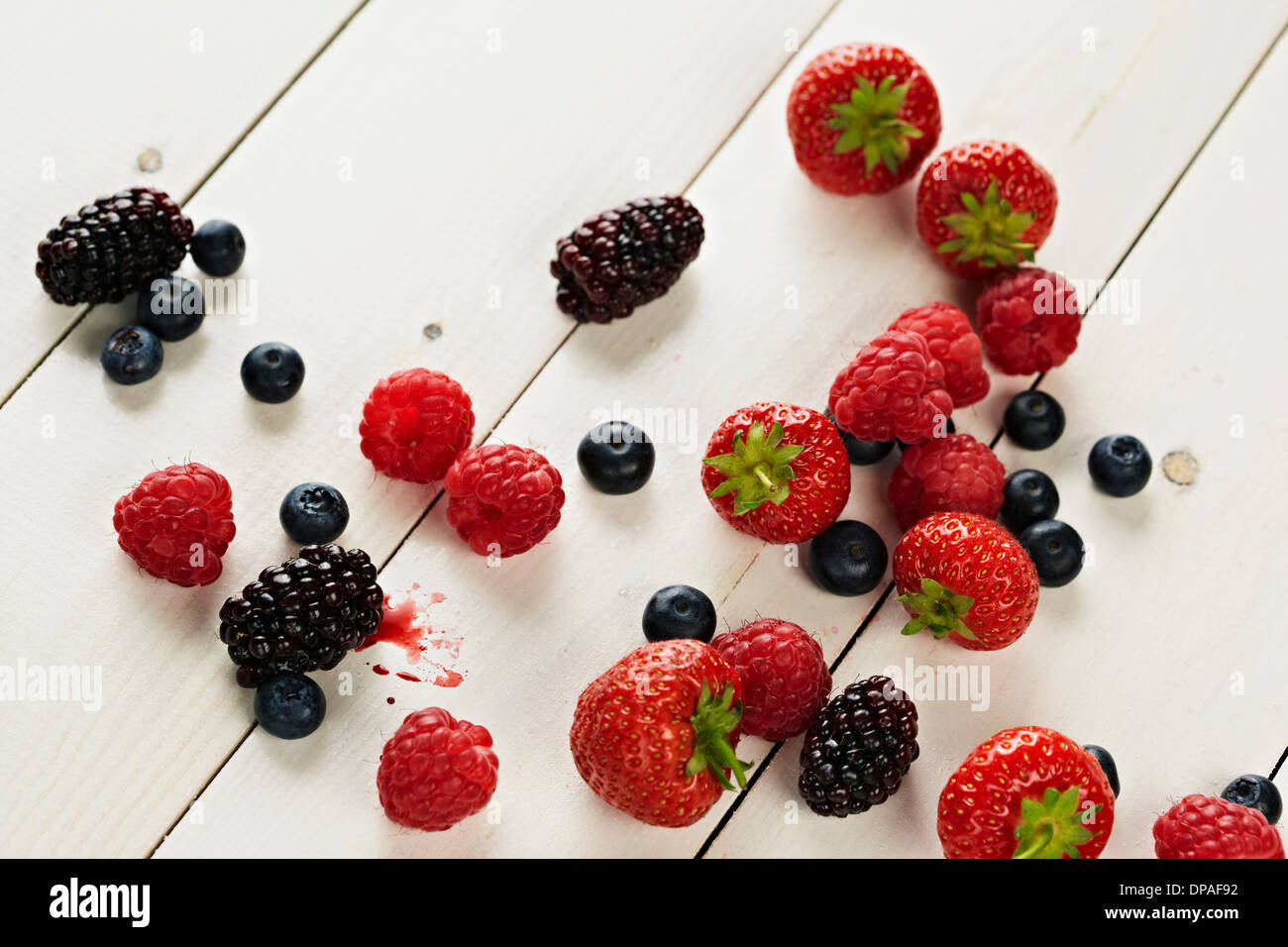 Strawberries, raspberries, blackberries and blueberries still life ...