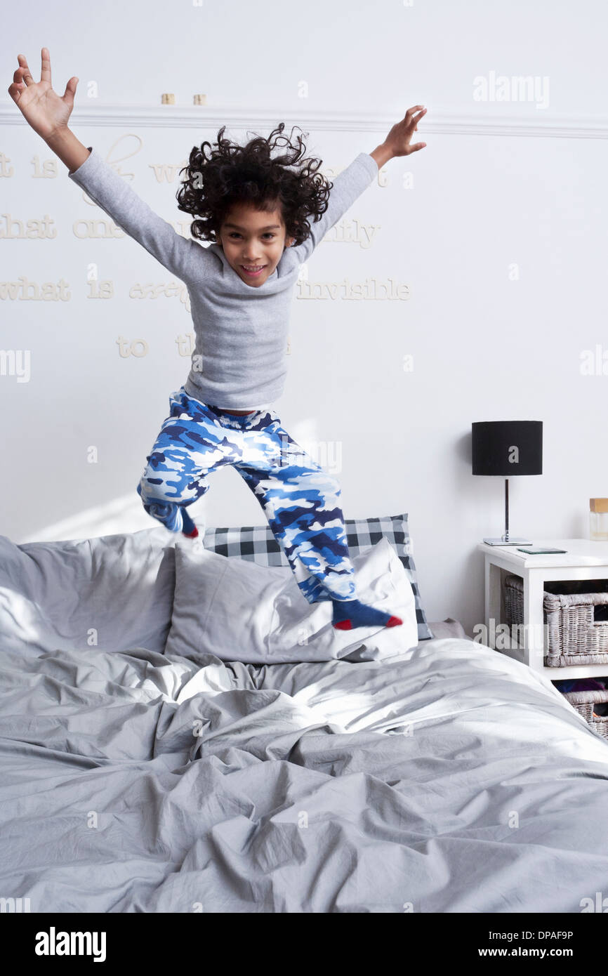 Boy jumping up hi-res stock photography and images - Alamy