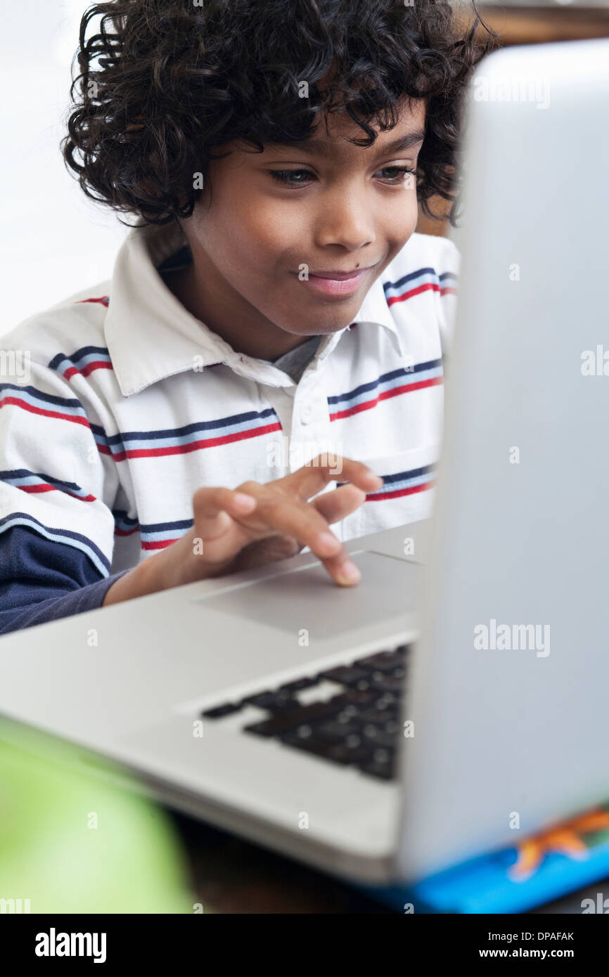 Boy using laptop hi-res stock photography and images - Alamy