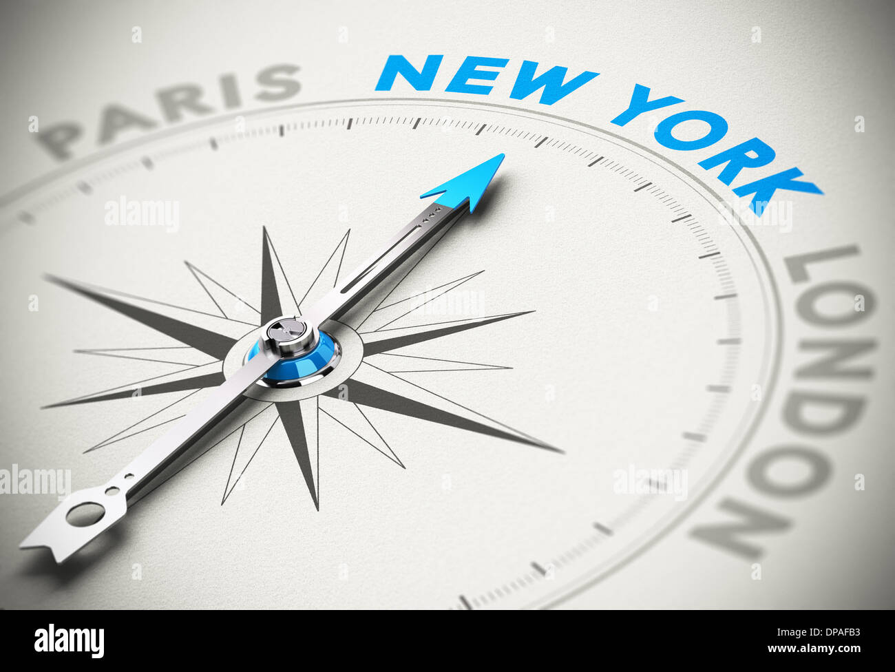 Needle of a compass pointing the word New York with blur effect and ...