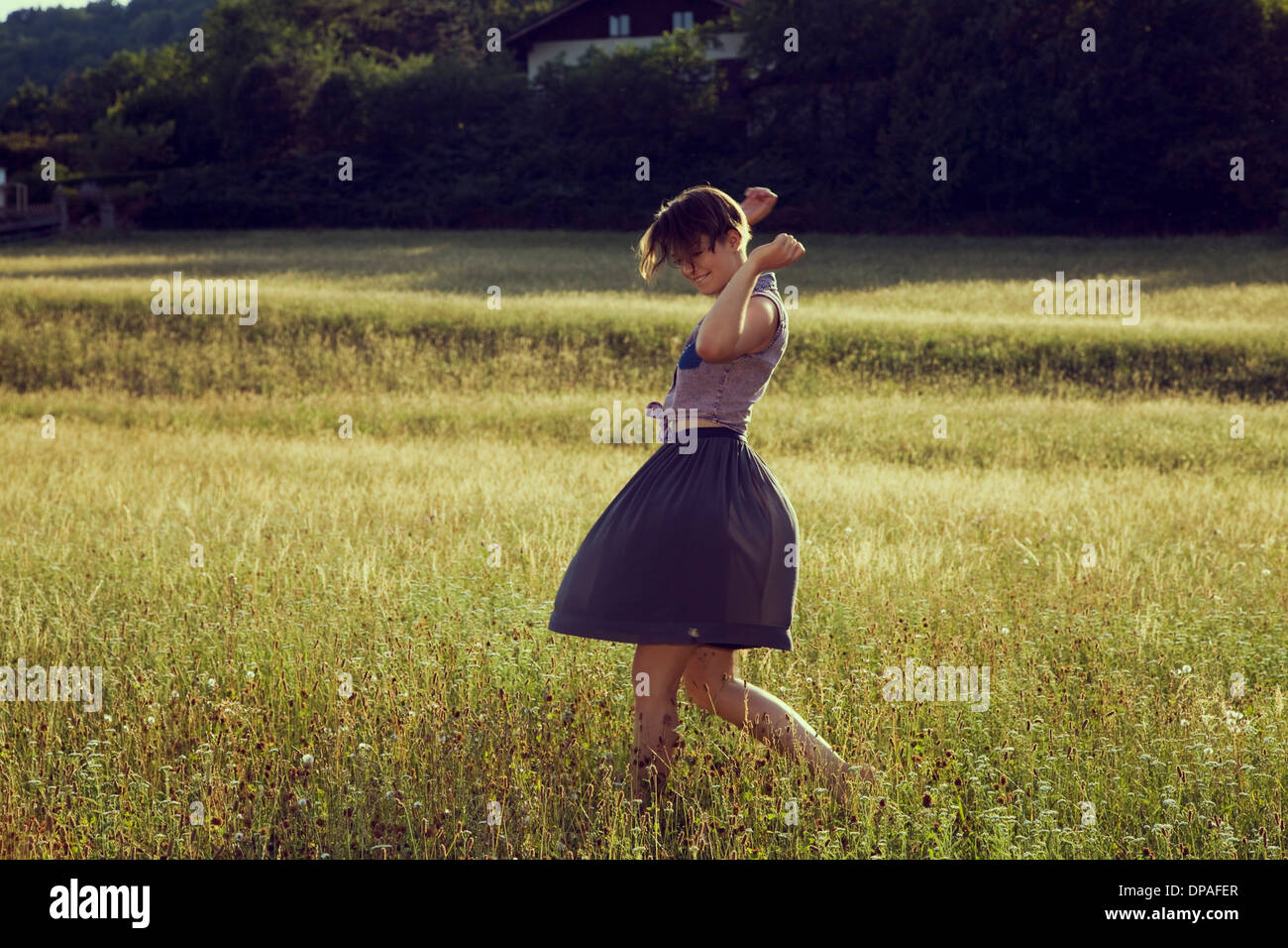 Woman strolling through field hi-res stock photography and images - Alamy
