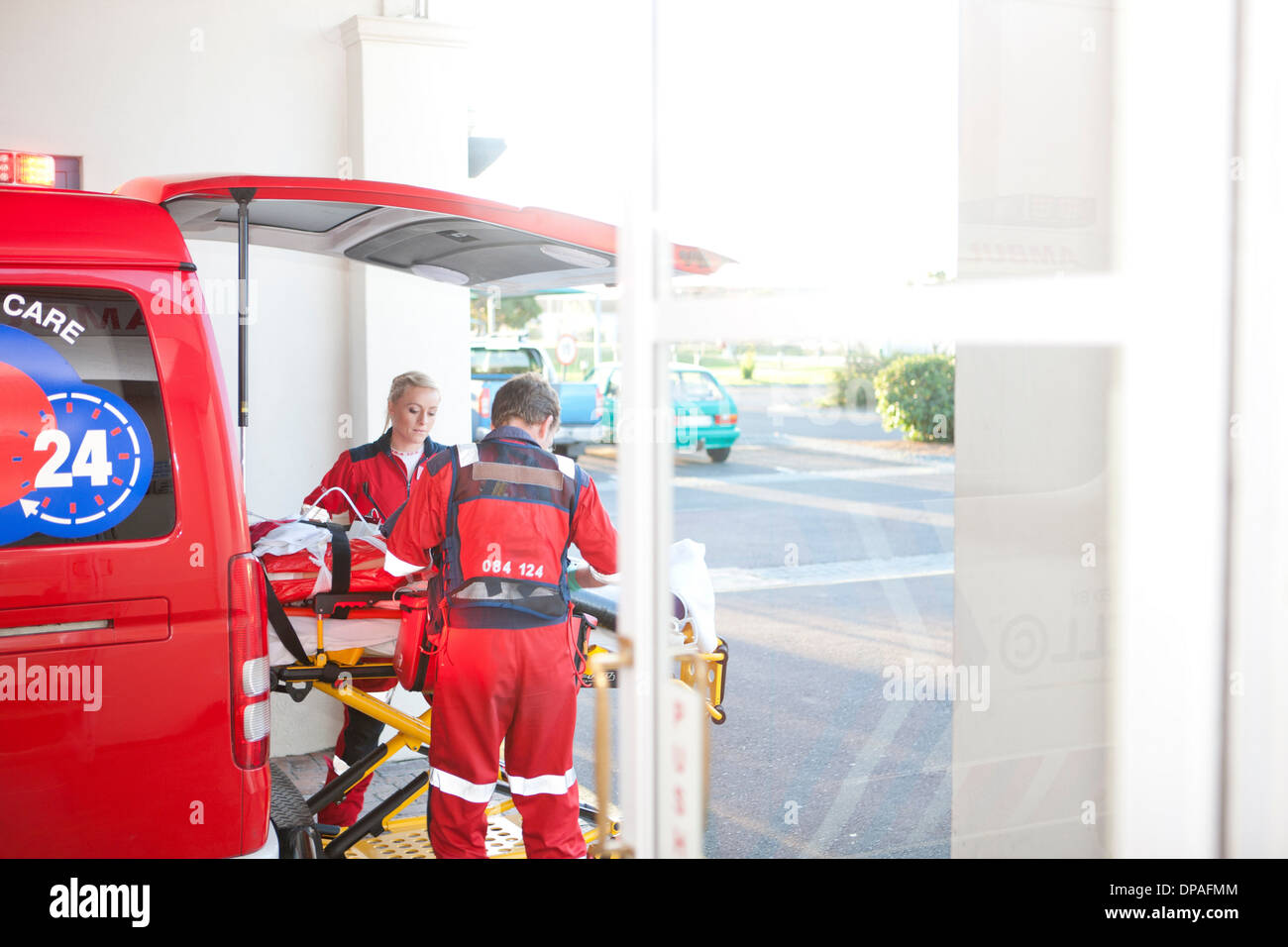 Paramedics moving patient from ambulance to hospital Stock Photo - Alamy