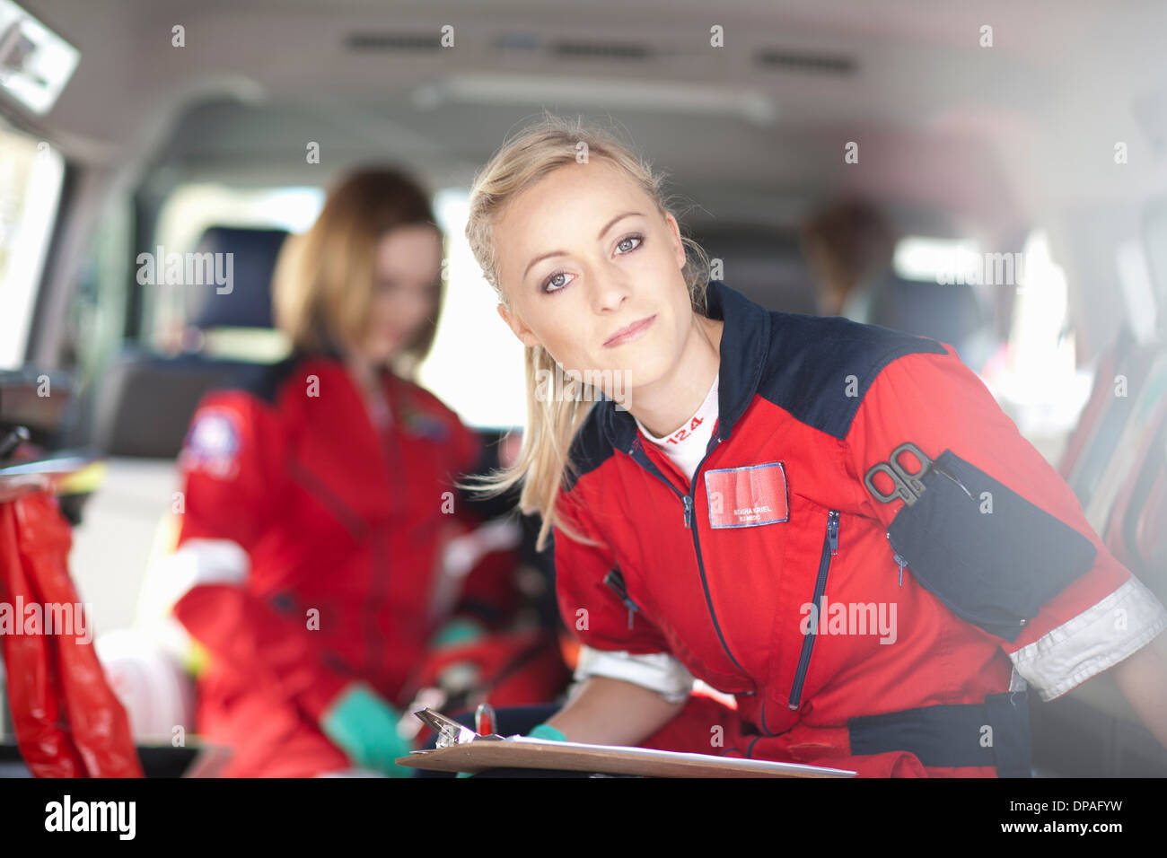 Portrait of paramedics in ambulance Stock Photo - Alamy