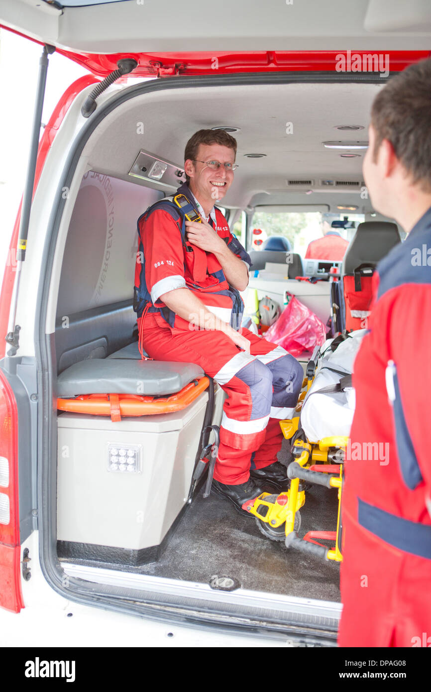 Paramedic in ambulance waiting for call Stock Photo - Alamy