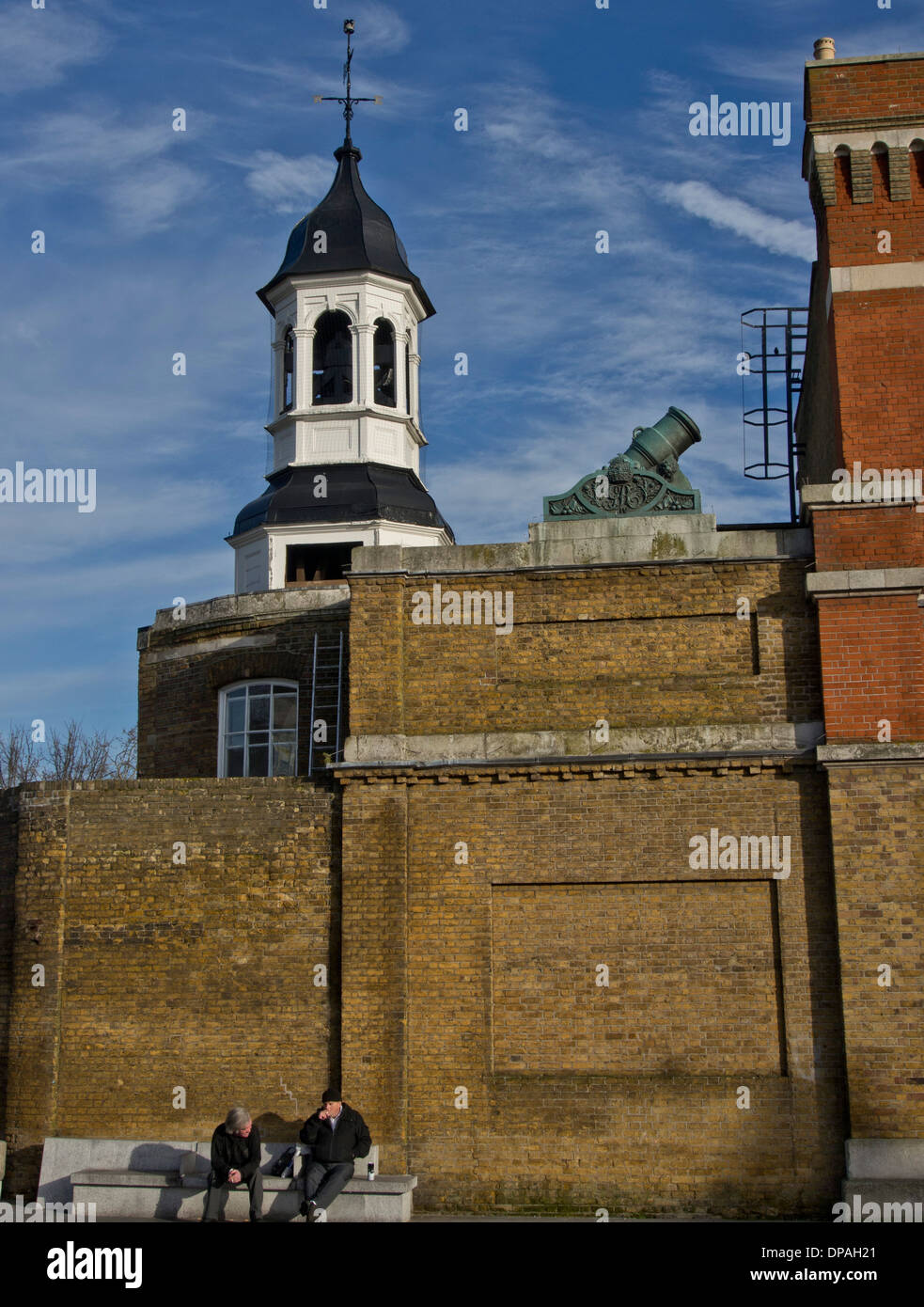 Elderly people sit in the High Street in Woolwich Arsenal, London, UK ...