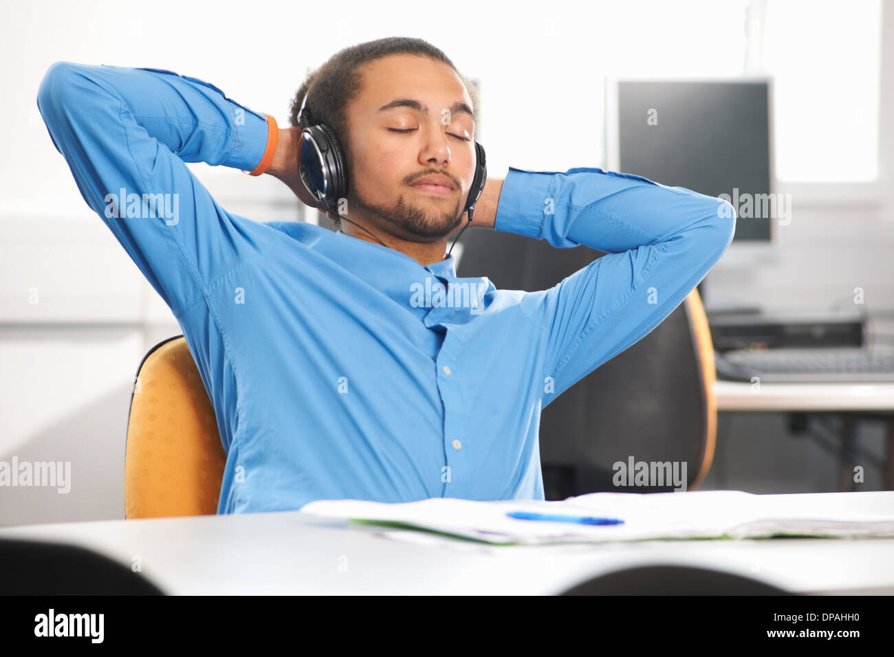 Young man wearing headphones Stock Photo - Alamy