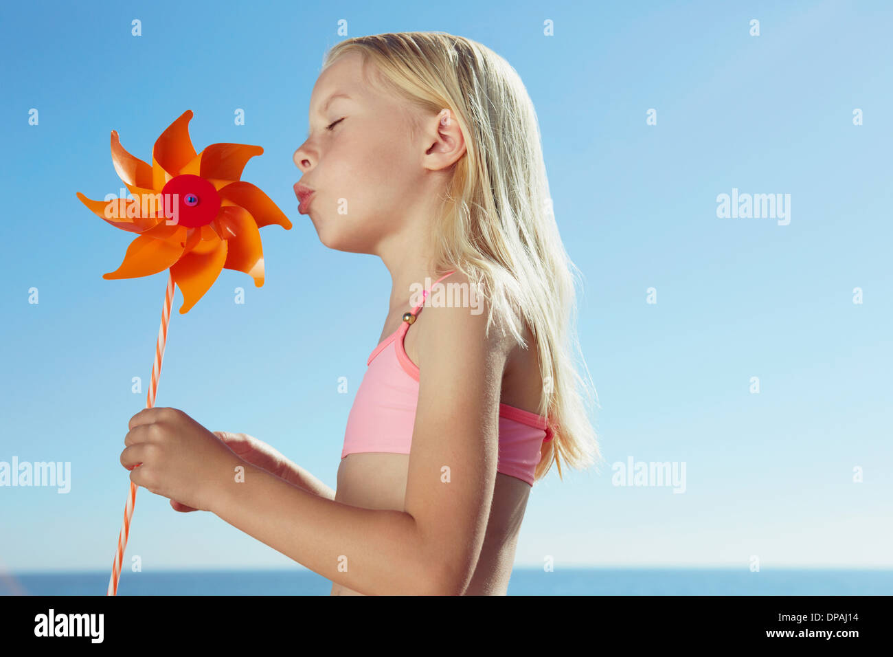 Girl blowing at toy windmill Stock Photo - Alamy Girl blowing at toy windmill Stock Photo - Alamy