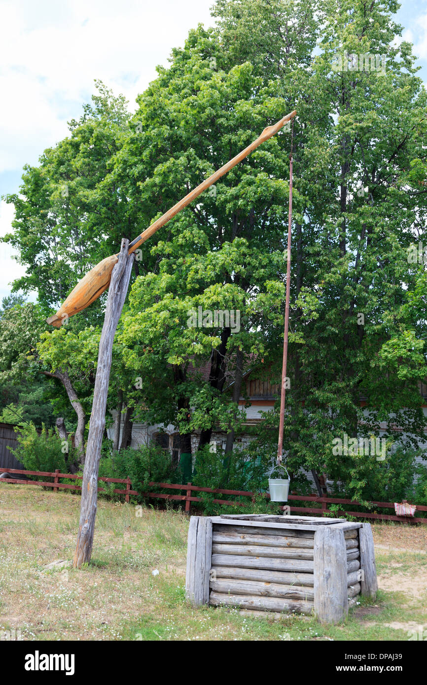 Wooden village well Stock Photo - Alamy