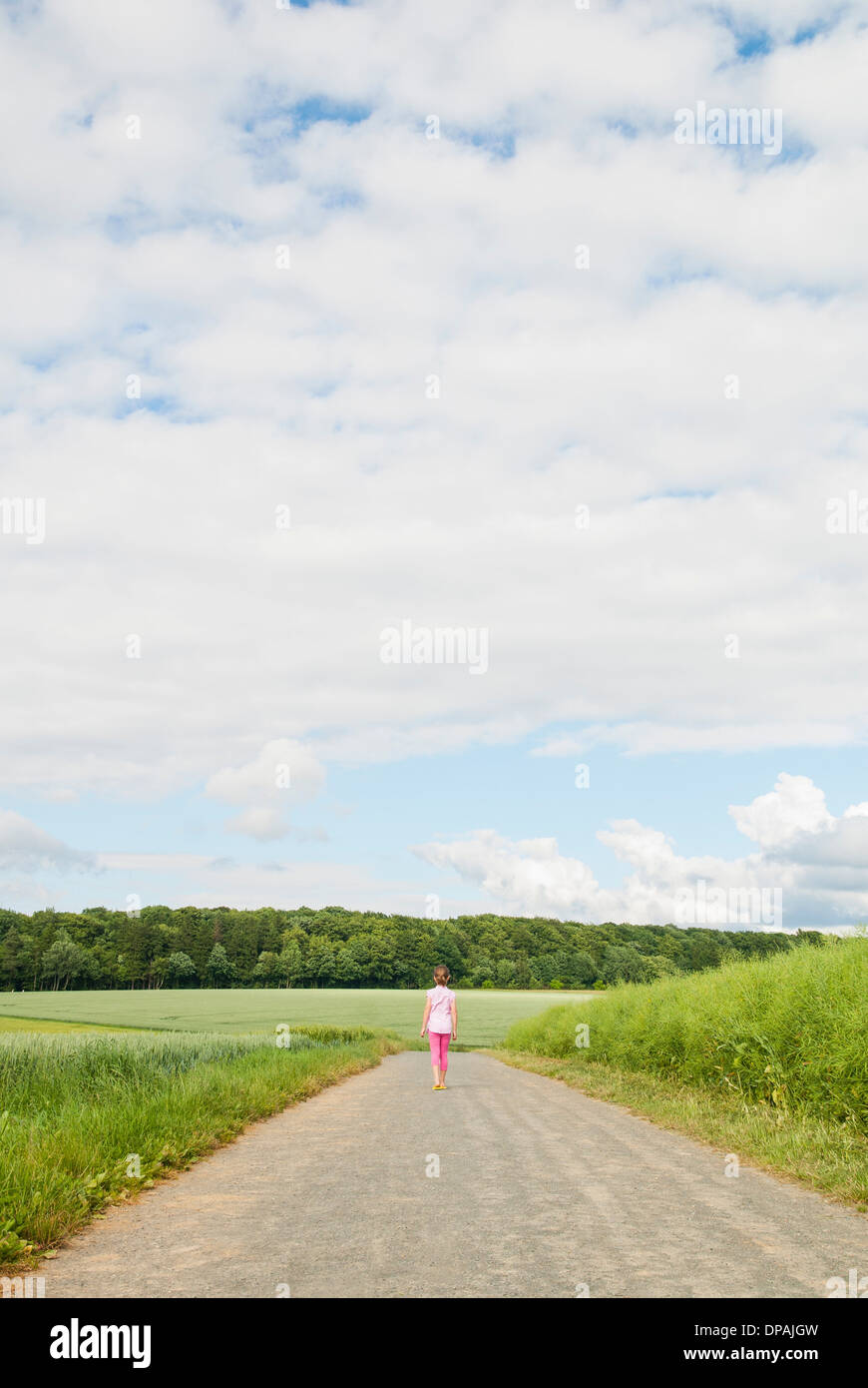 Child walking down rural road hi-res stock photography and images - Alamy
