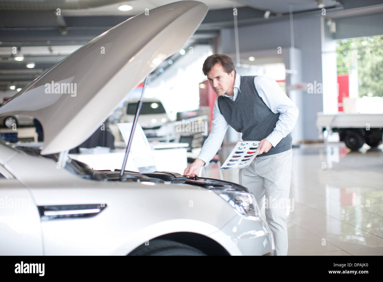 Man looking in car bonnet hi-res stock photography and images - Alamy