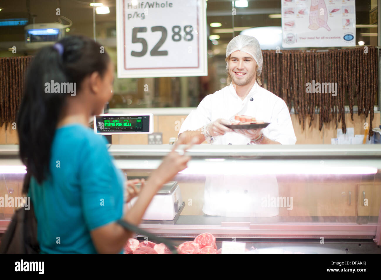 Supermarket ethnic shop assistant hi-res stock photography and images ...