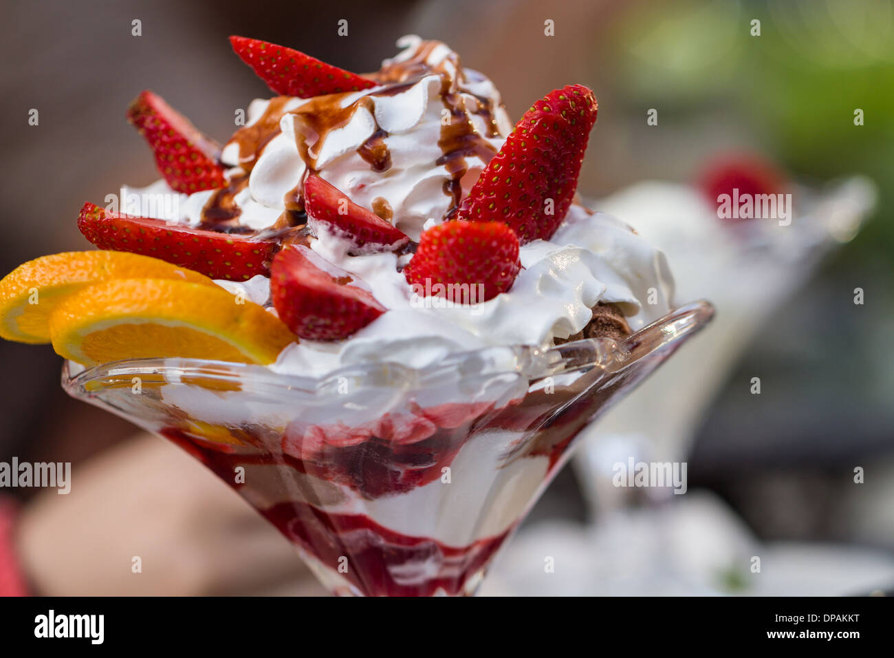 Delicious vanilla sundae with strawberry shoot with short DOF Stock ...
