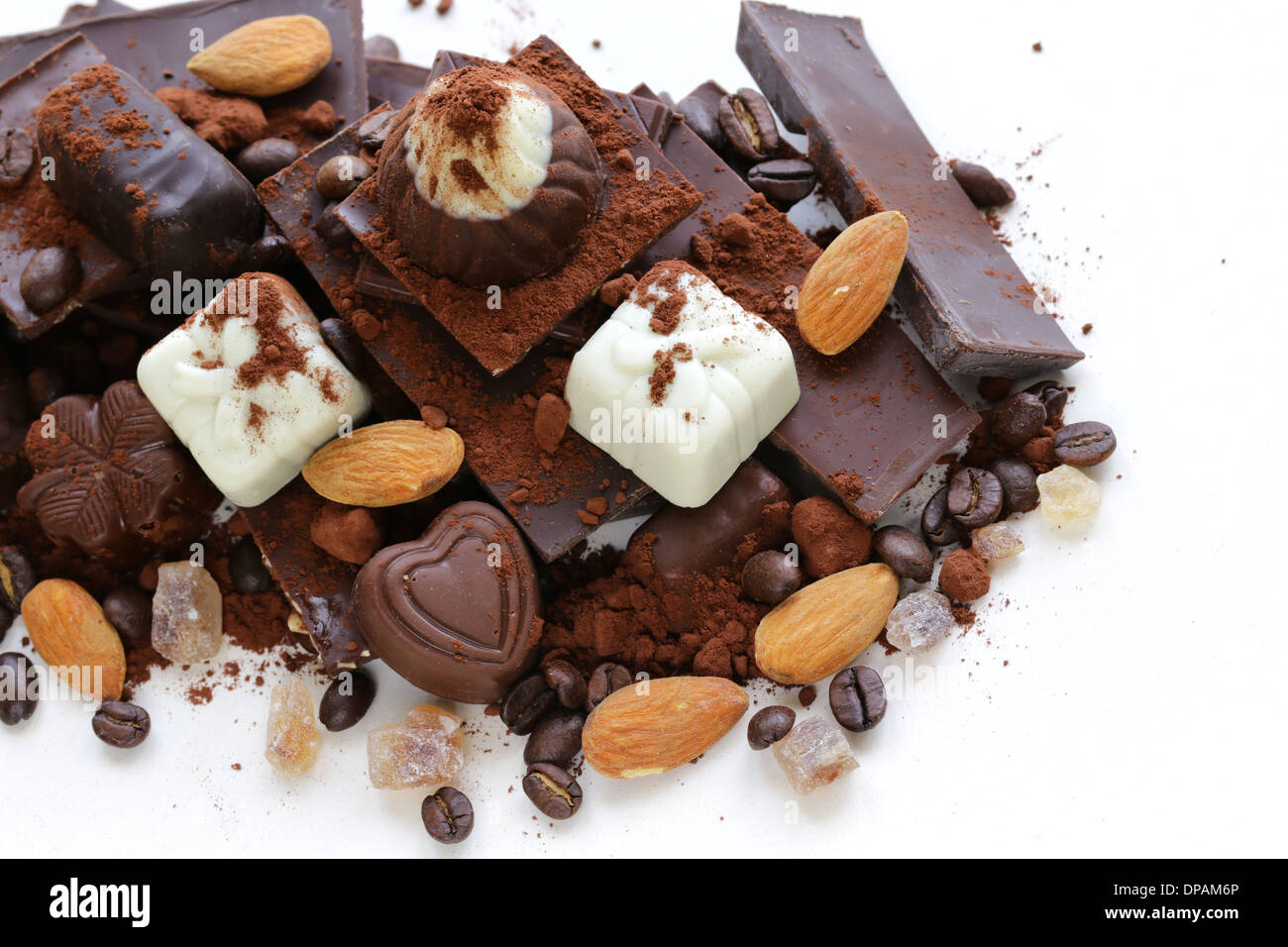 different varieties of chocolate and sweets on a white background Stock ...