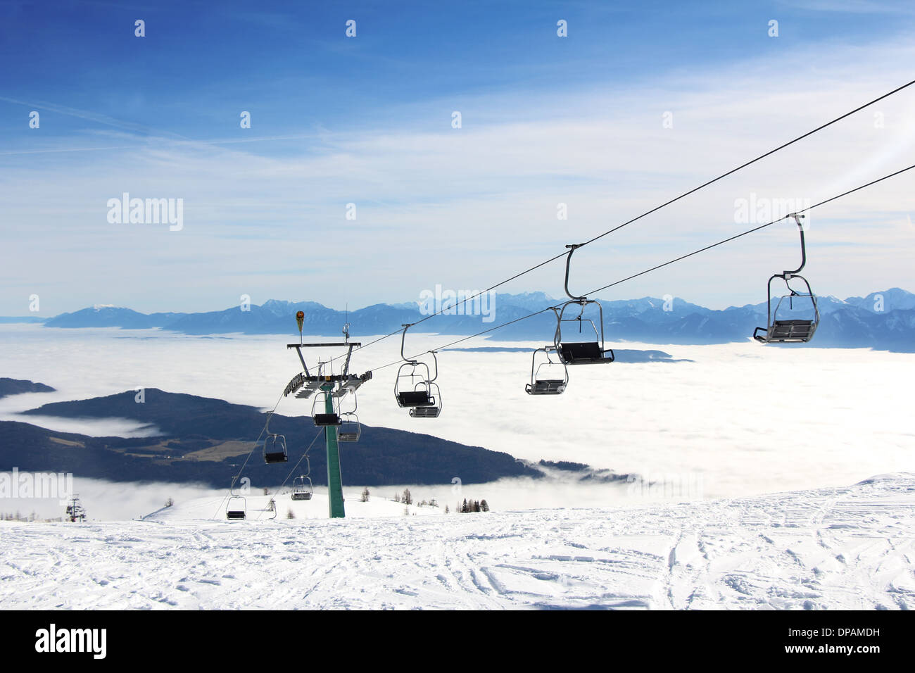 Ski lift and skiers on the Mountain ski resort Gerlitzen, Austria Stock ...