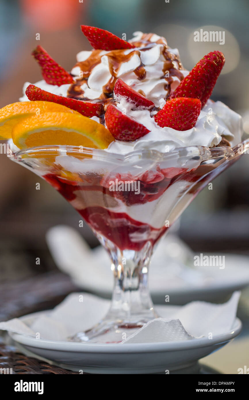 Delicious vanilla sundae with strawberry shoot with short DOF Stock ...
