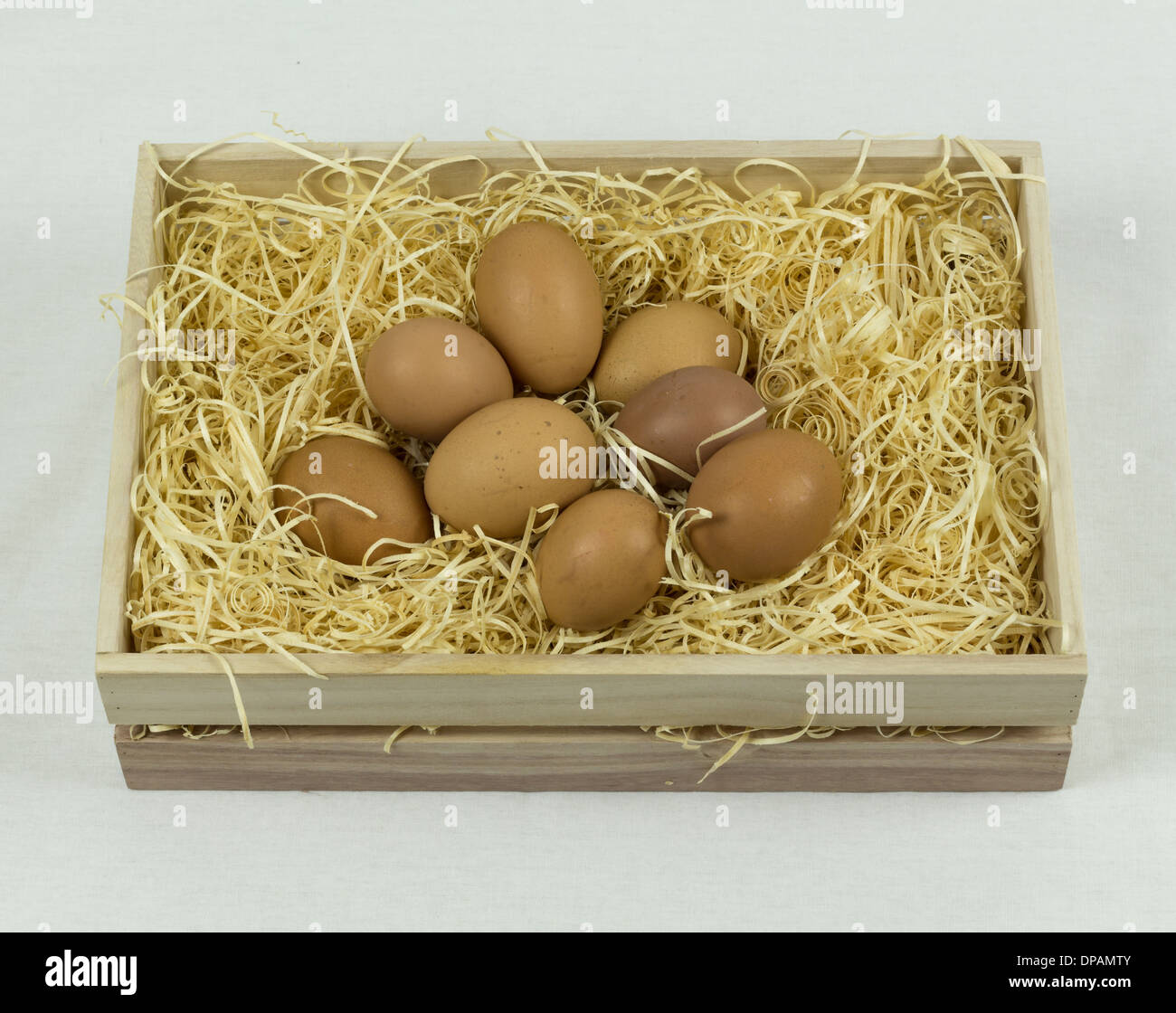Photo of eggs in wooden crate on straws Stock Photo - Alamy
