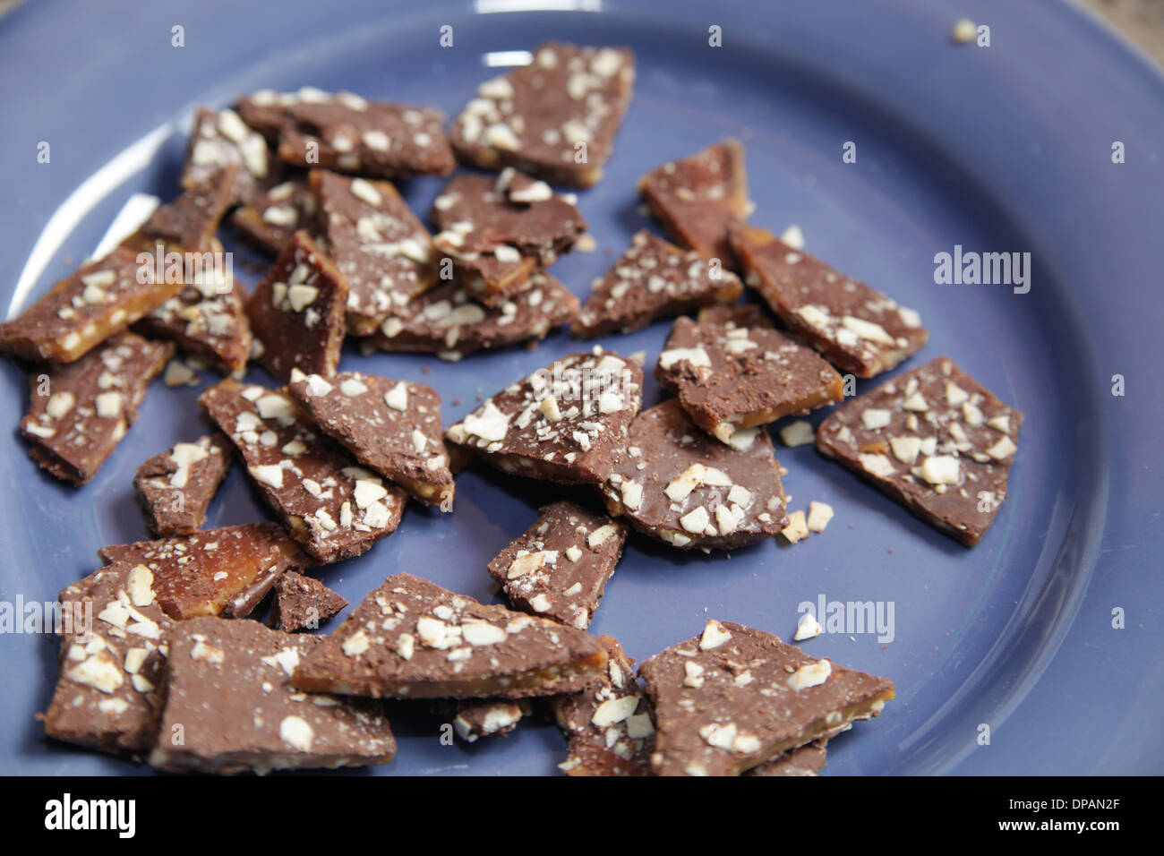 homemade toffee on a blue plate Stock Photo - Alamy